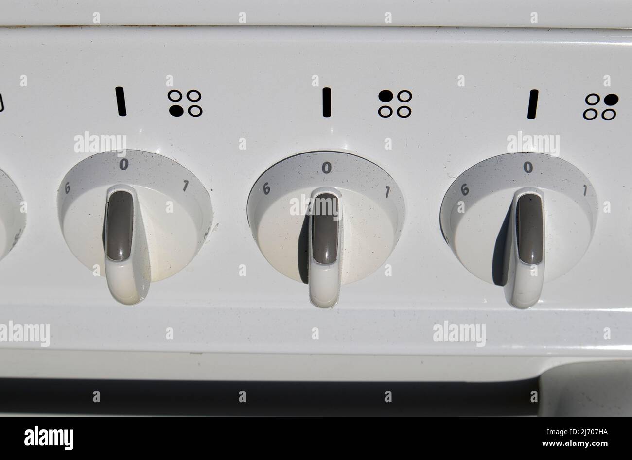 dusty electric kitchen stove control switches Stock Photo - Alamy