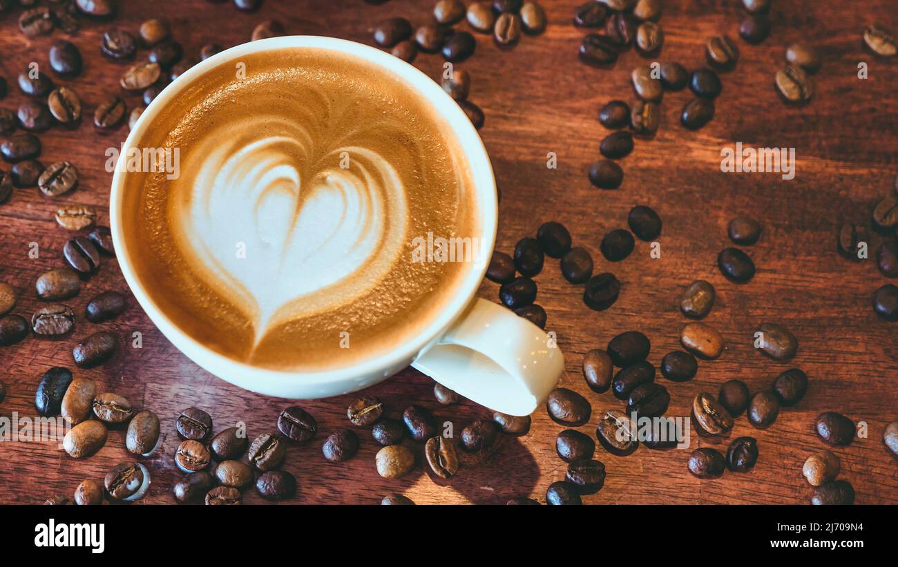 coffee latte art on wood table flat lay , relax time, cafe barista art ...
