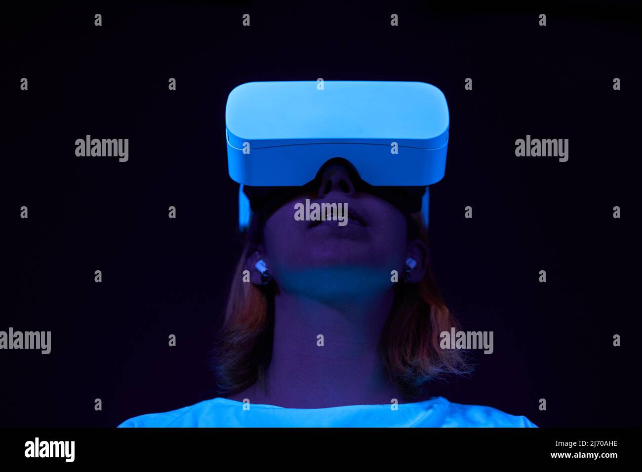 Woman interting with virtual reality using vr headset. Concept of ... Woman interting with virtual reality using vr headset. Concept of ...