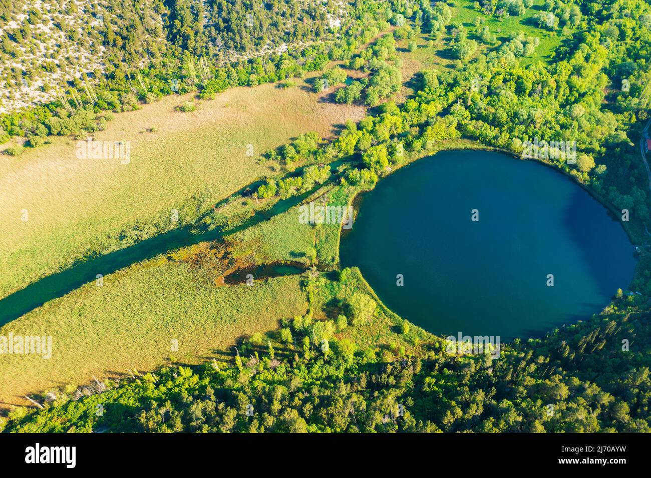 Aerial view of Torak lake spring in the Cikola River canyon, Croatia ...