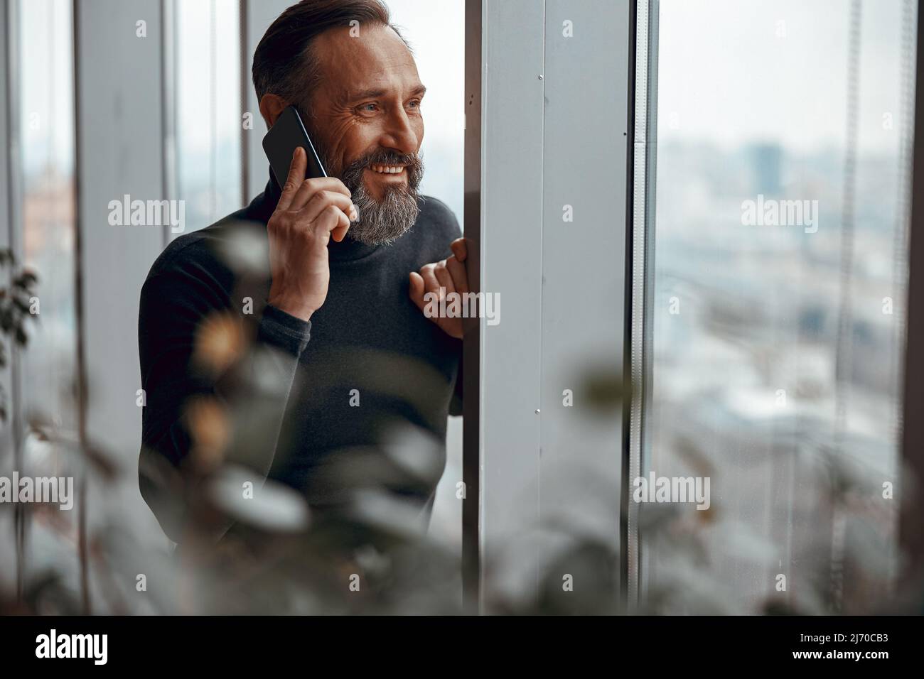 Happy adult man using hi-res stock photography and images - Alamy