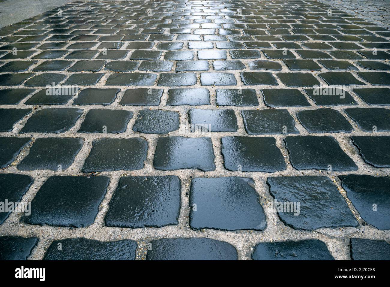 Old wet stone sidewalk or pavement as texture or background ...