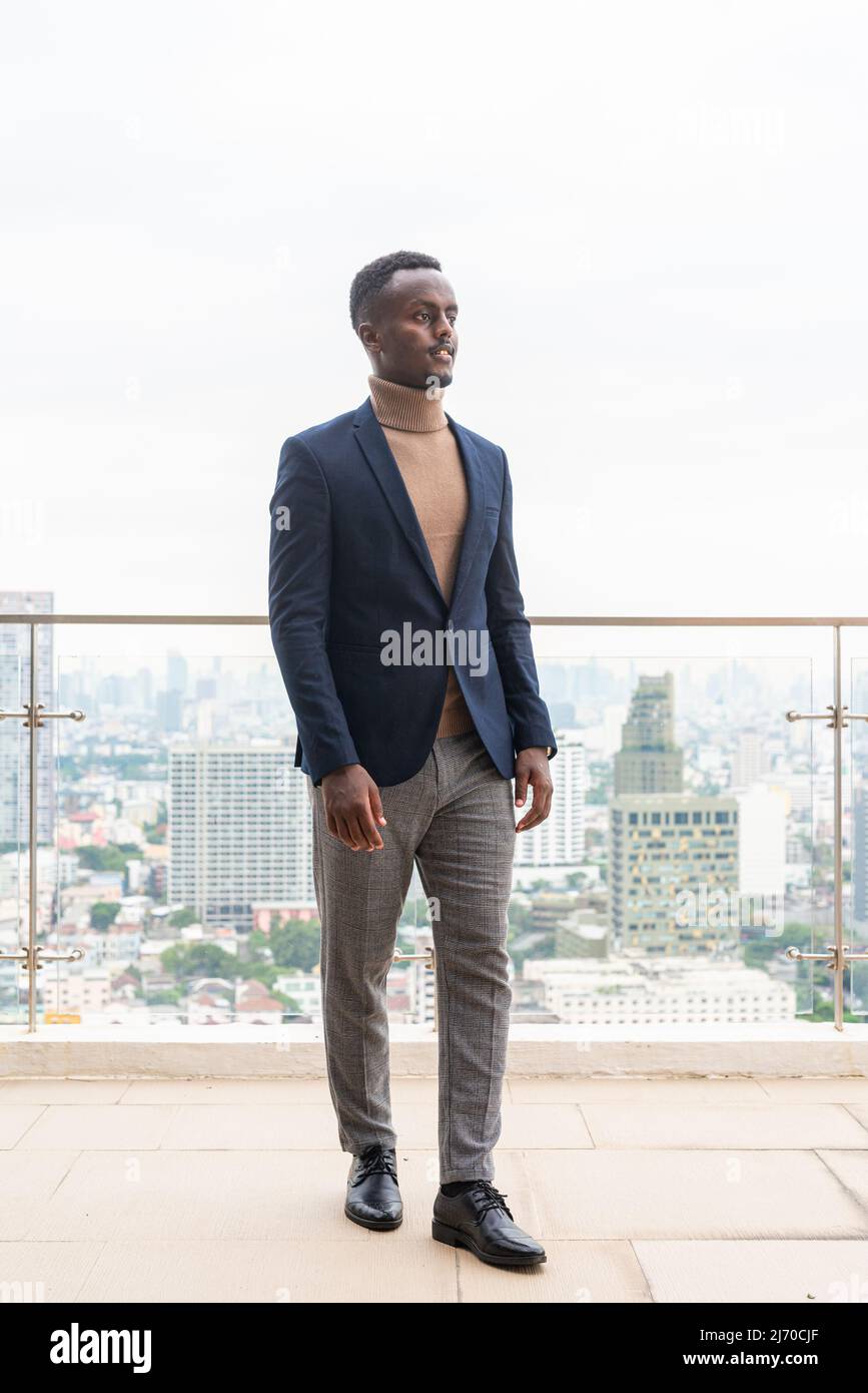 Full length portrait of young successful black businessman Stock Photo ...