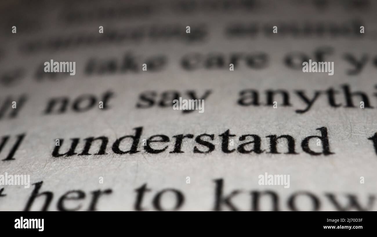 Understand text in open book page, selective focus, close up, macro ...