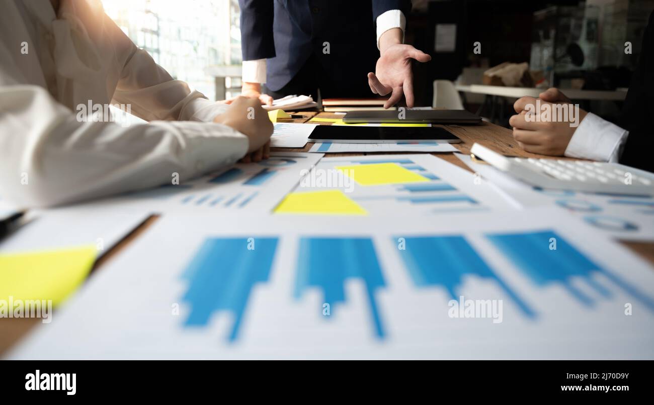 Business team working with financial plan, meeting, discussion ...