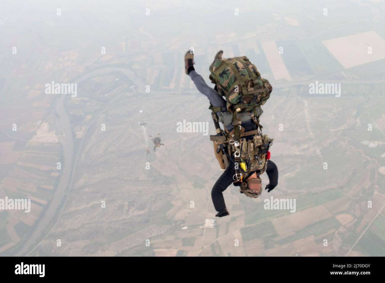 U.S. Army Special Operations Forces (SOF) jump from a U.S. Air Force MC ...