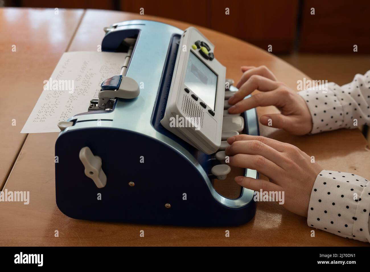 Blind woman using braille typewriter Stock Photo - Alamy