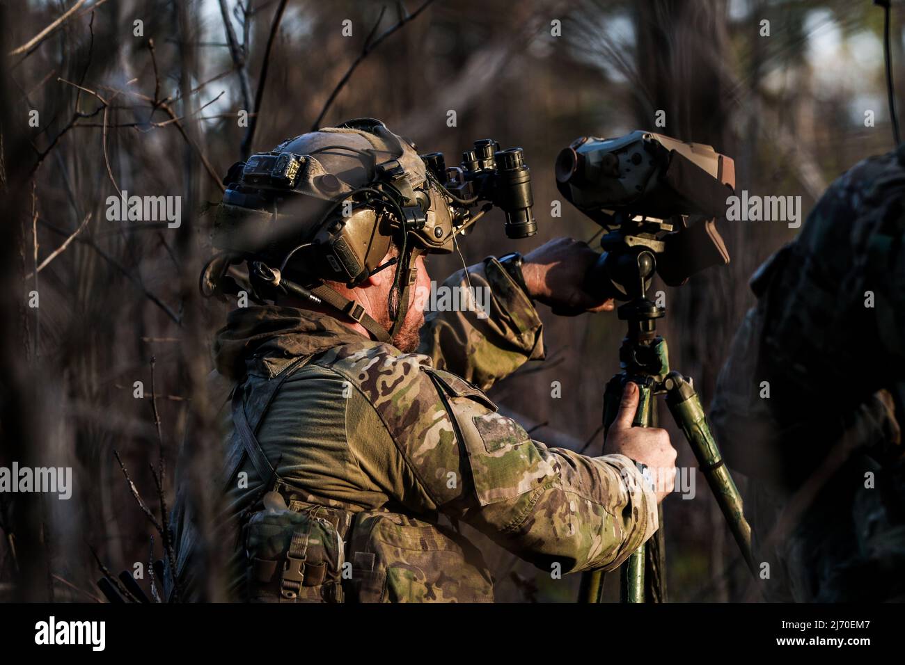 A Green Beret assigned to 3rd Special Forces Group (Airborne) conduct ...