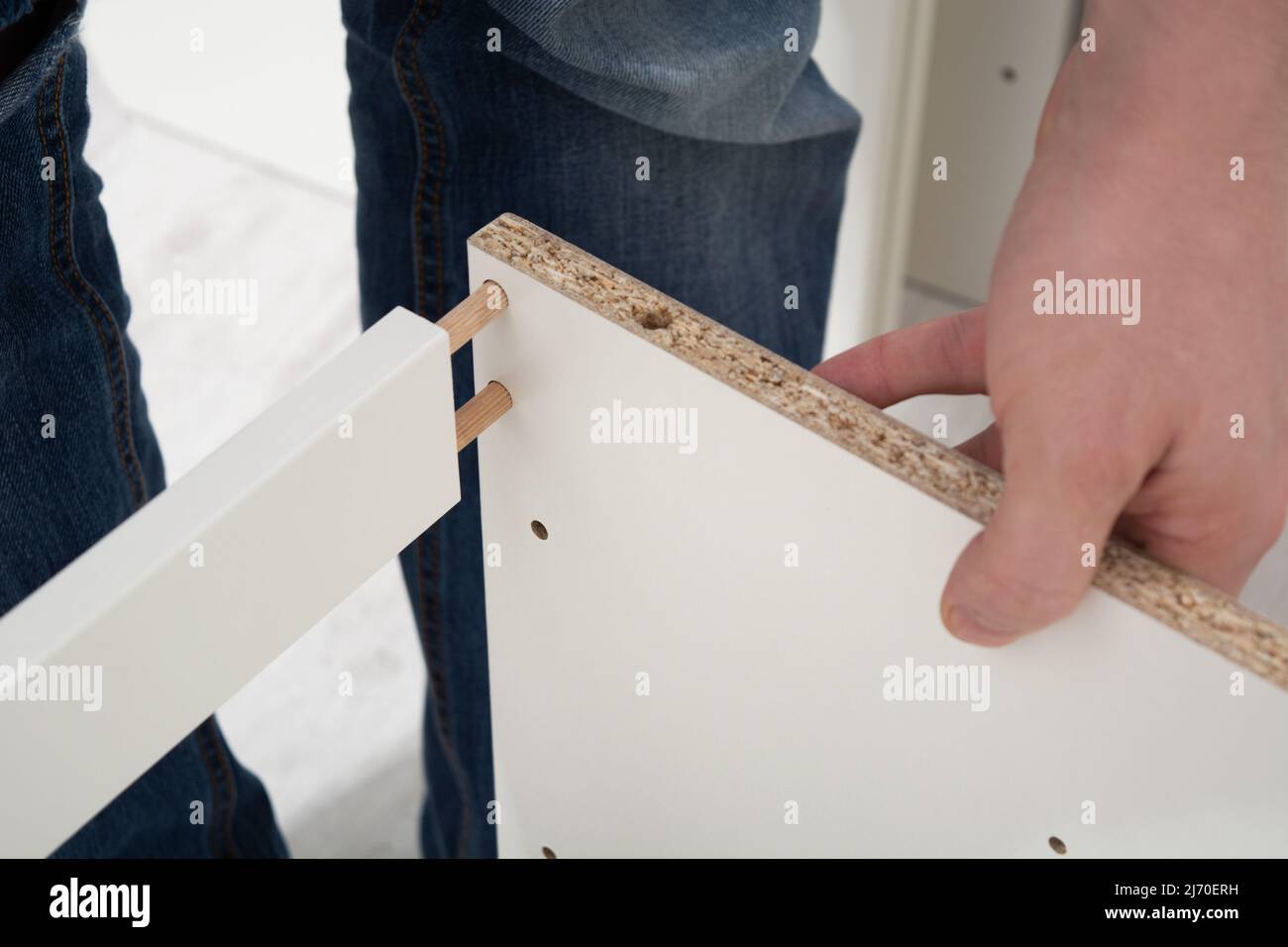 Assembly cabinet furniture. Do it youself concept. White chipboard ...