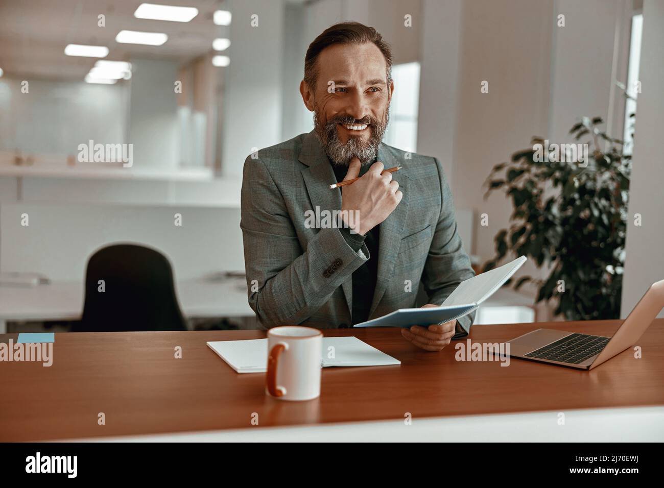 Mature accountant working notebook hi-res stock photography and images ...