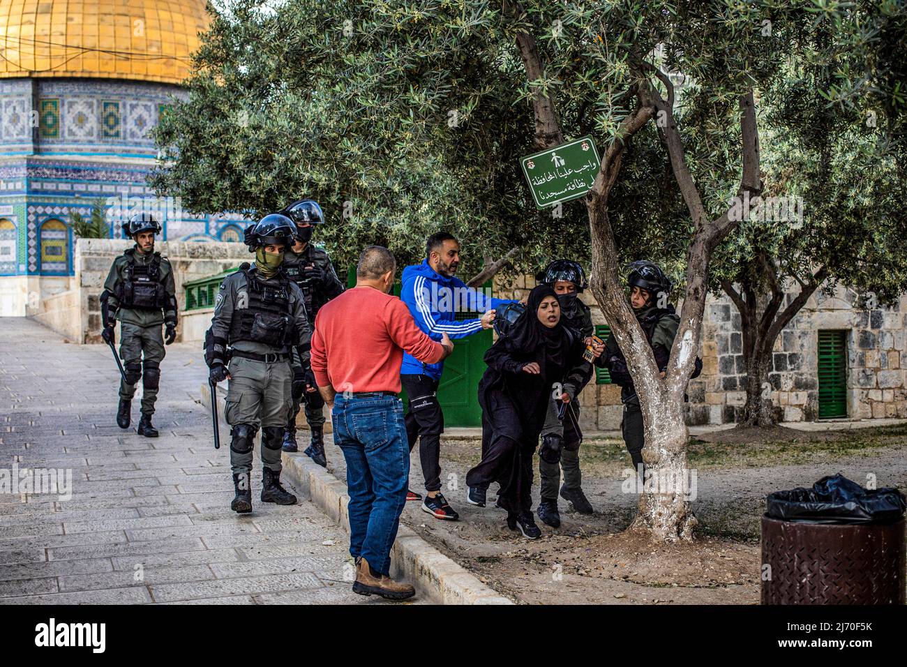 05 May 2022, ---, Jerusalem: Israeli security officers push away a ...