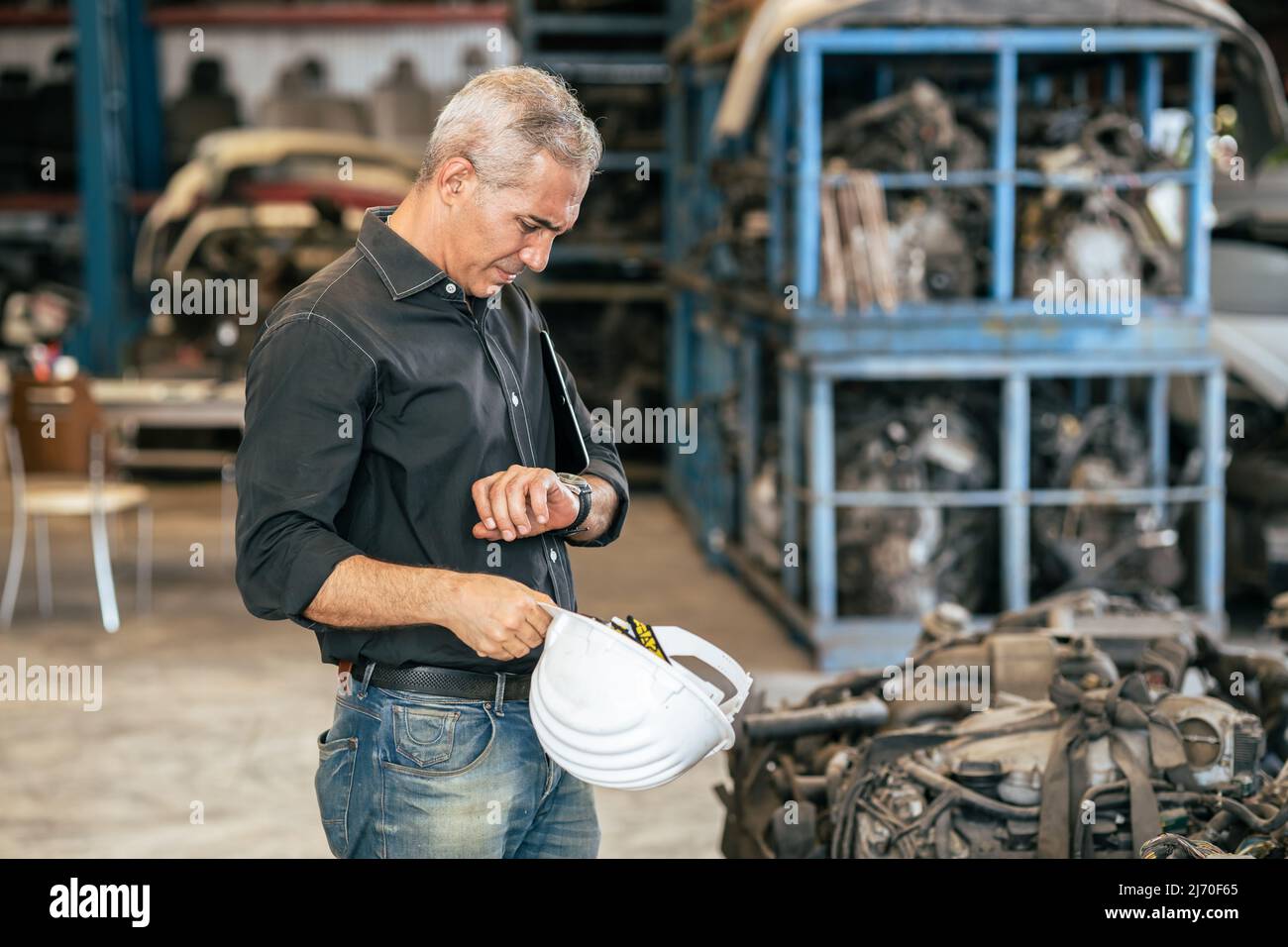 engineer male worker looking wrist watch for stress worry with working ...