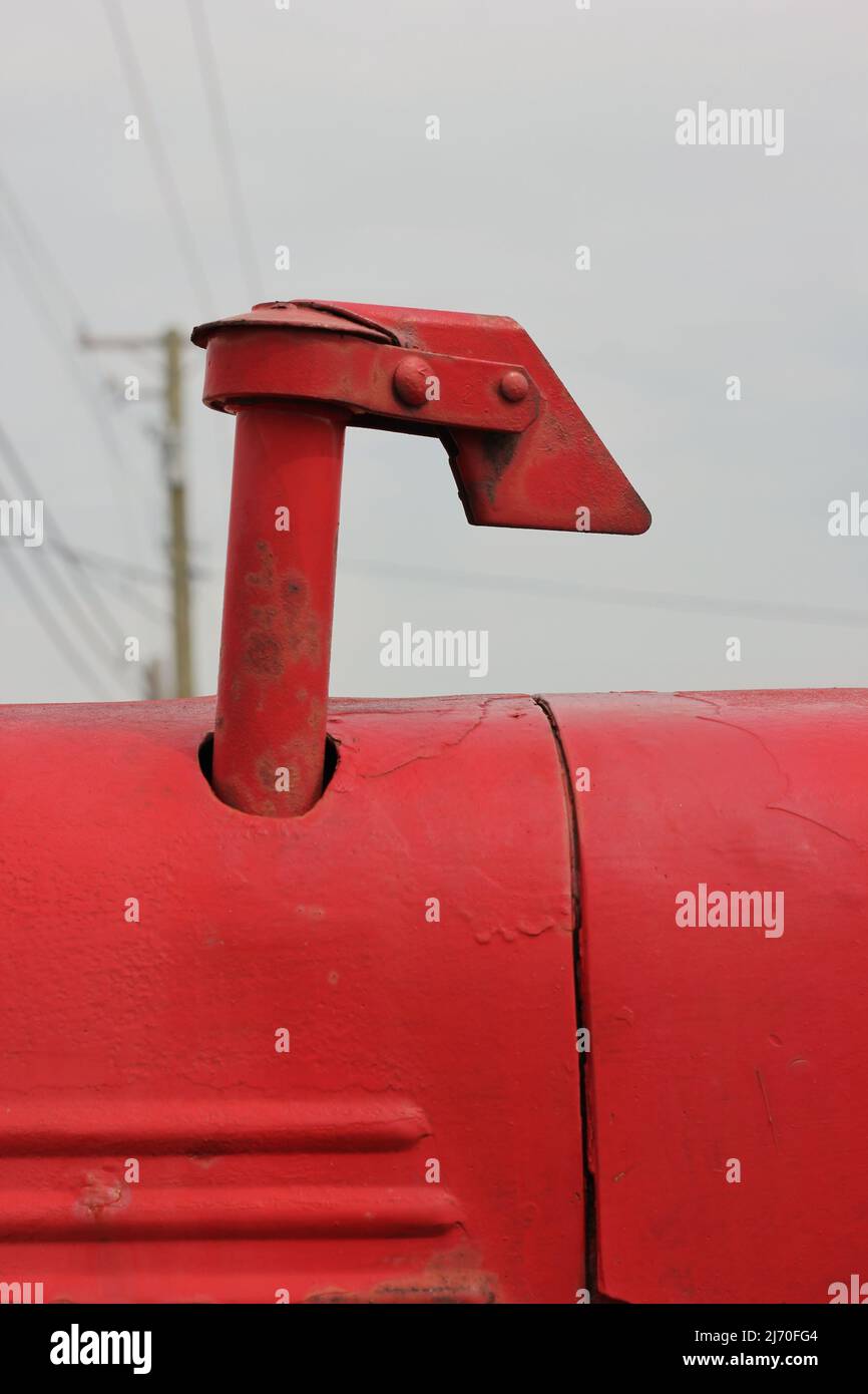 Traditional vintage bright red tractor mechanical engine and frame ...
