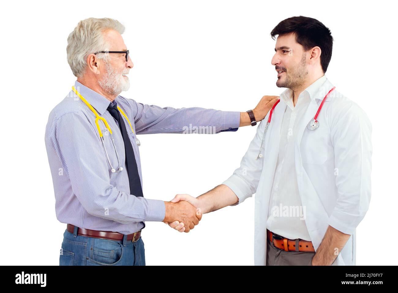 elderly doctor professor shakes hands to congratulate the new young ...