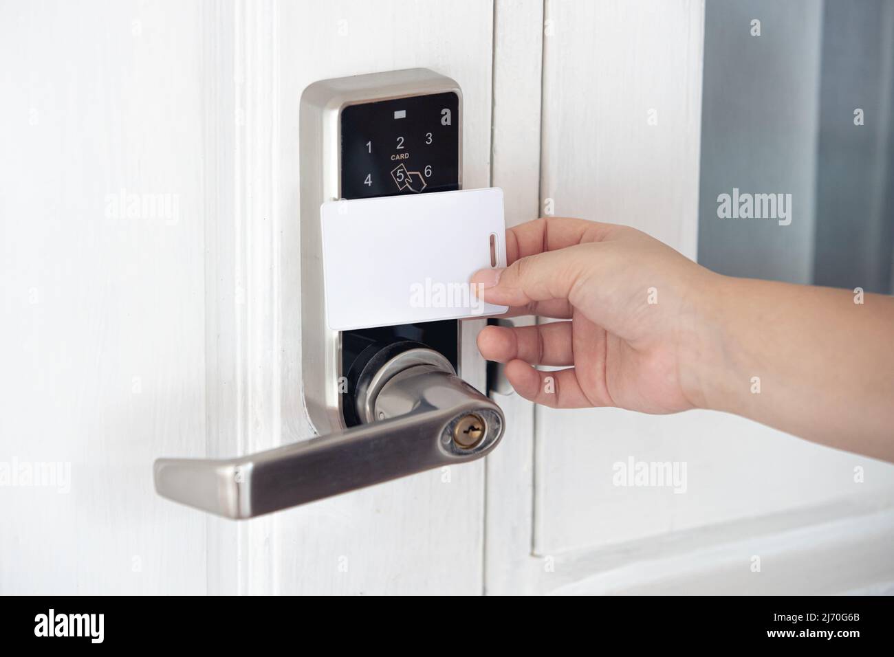 closeup people using contactless ID card scan door locker security ...