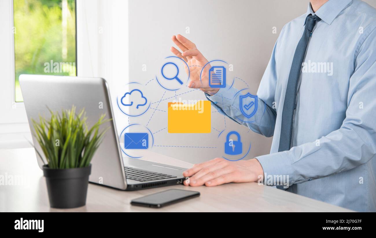 Document Management System DMS .Businessman hold folder and document ...