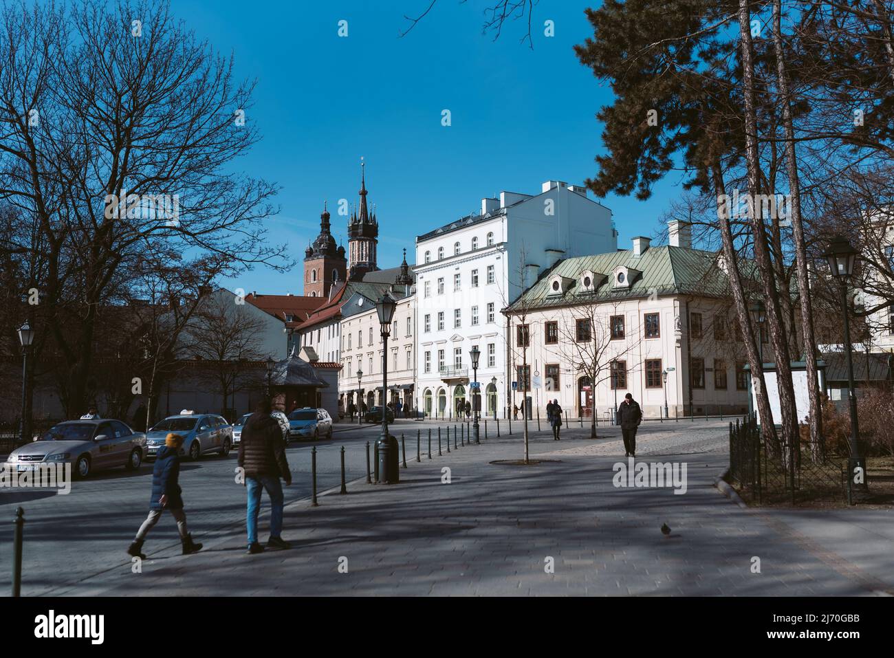 March 2, 2022 - Cracow, Poland: people walk in the city main square ...