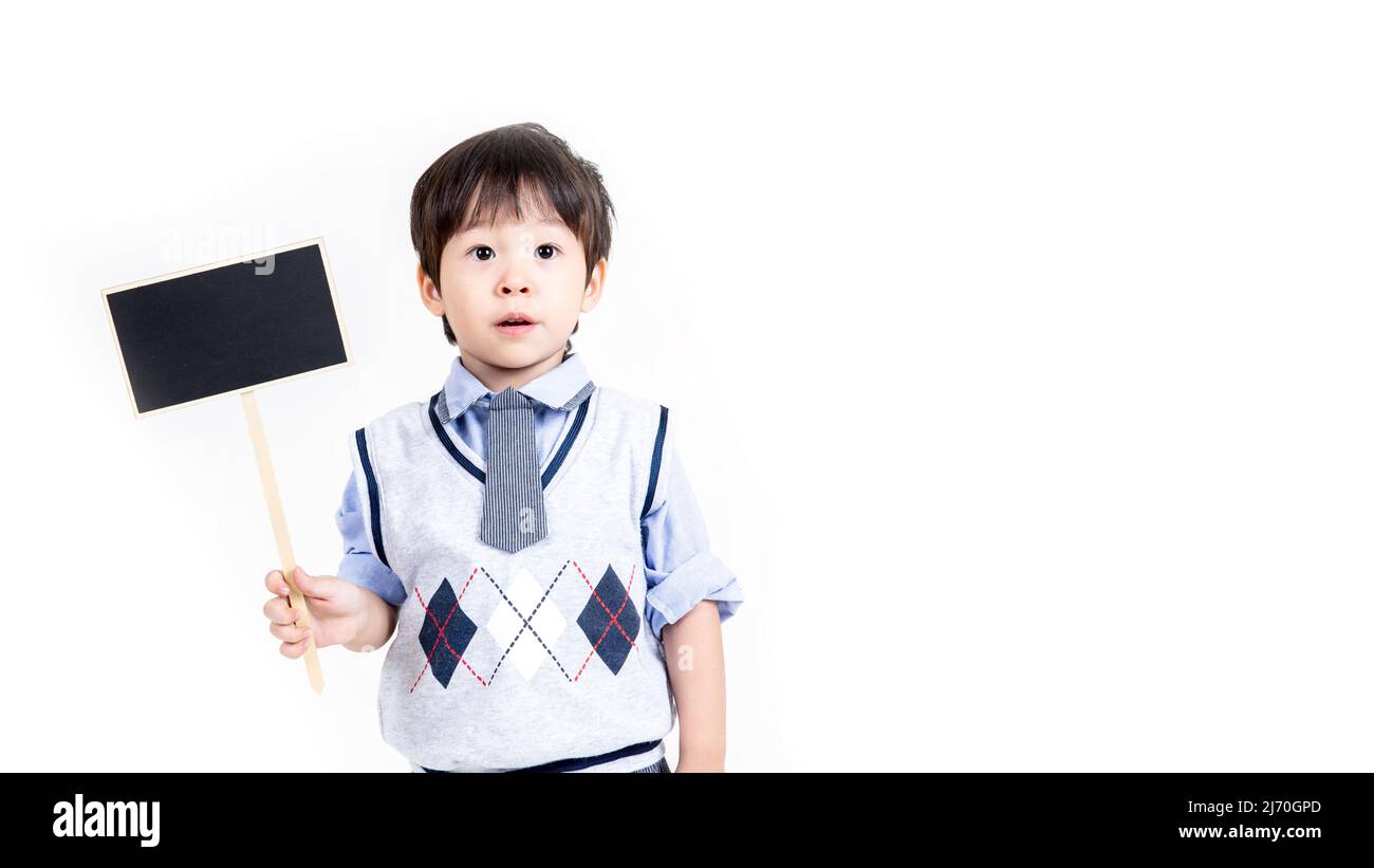 little boy holding a sign on white background Stock Photo - Alamy