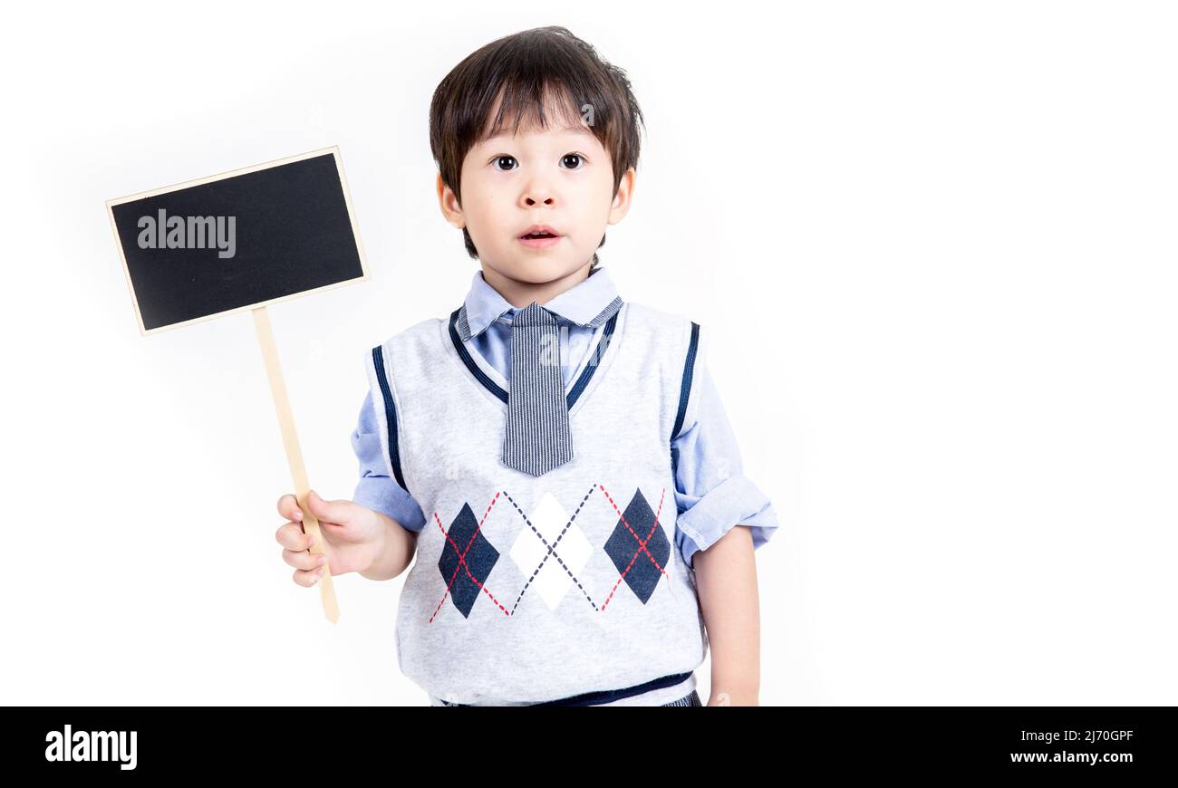 little boy holding a sign on white background Stock Photo - Alamy
