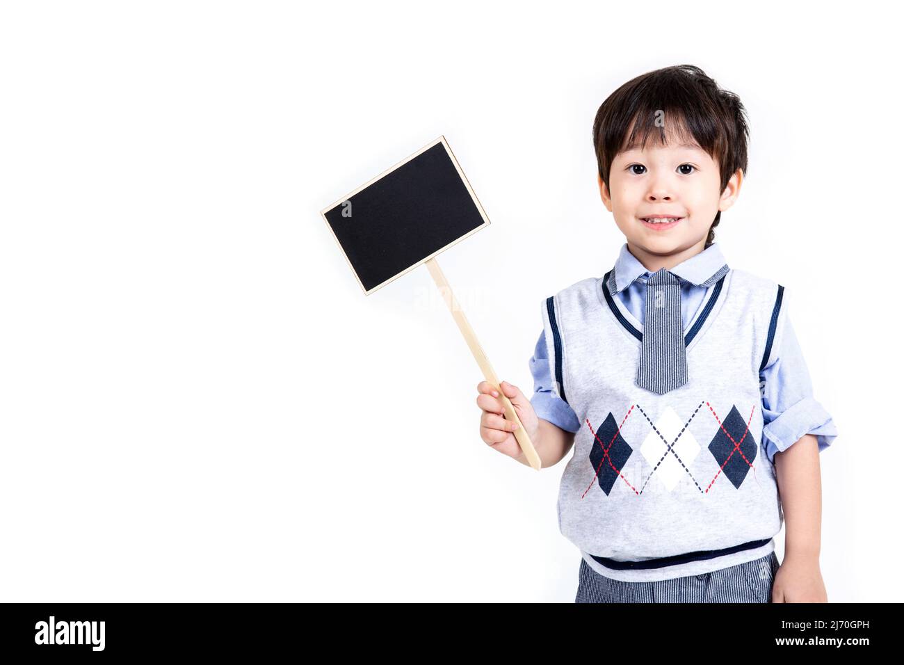 little boy holding a sign on white background Stock Photo - Alamy
