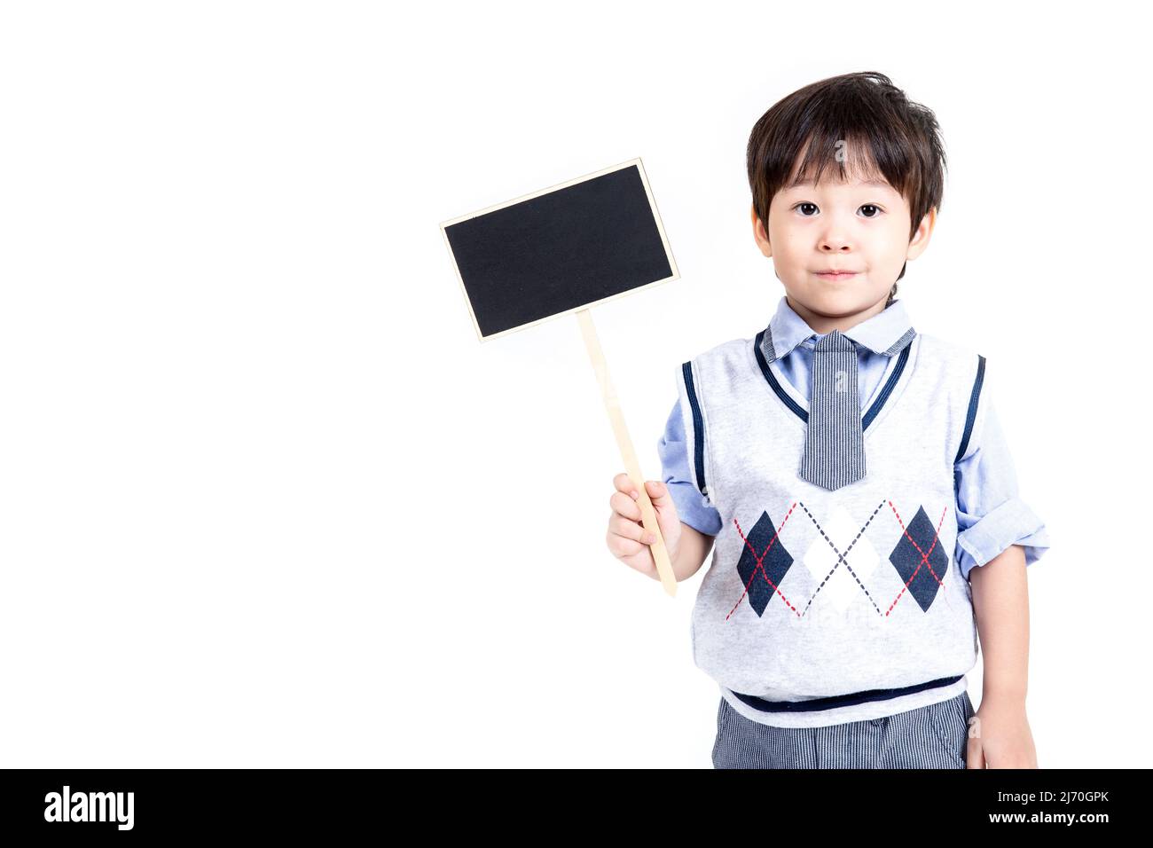 little boy holding a sign on white background Stock Photo - Alamy