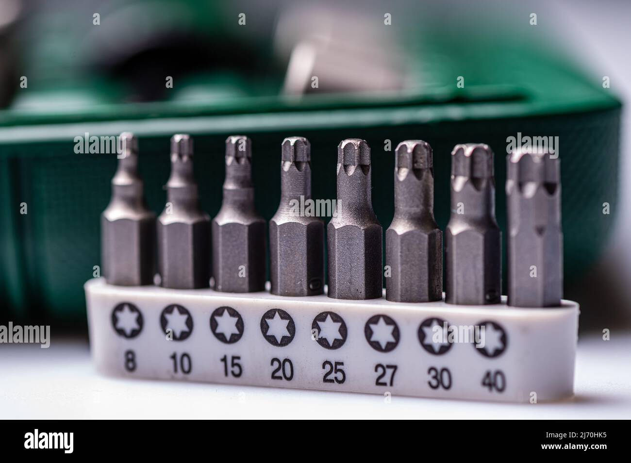 Interchangeable screwdriver bit set, isolated on white, selective focus ...