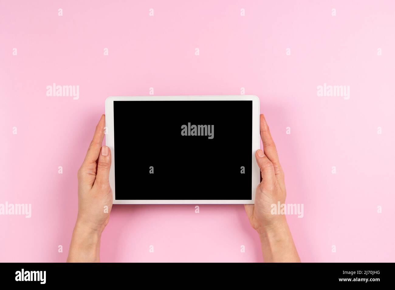 Woman hand holding digital tablet computer with blank screen mock up on ...