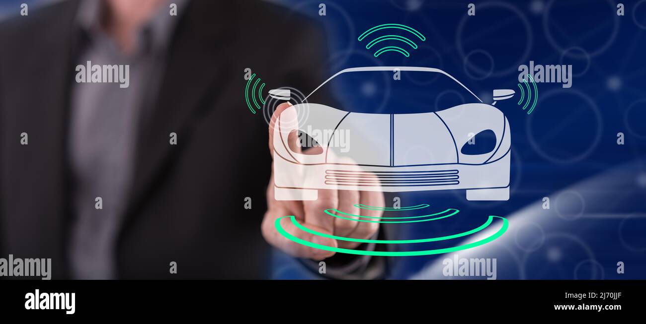 Man touching a smart car concept on a touch screen with his finger ...