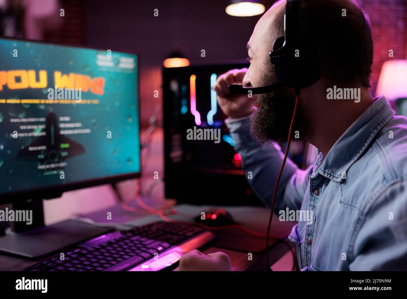 Successful gamer playing winning hi-res stock photography and images ...