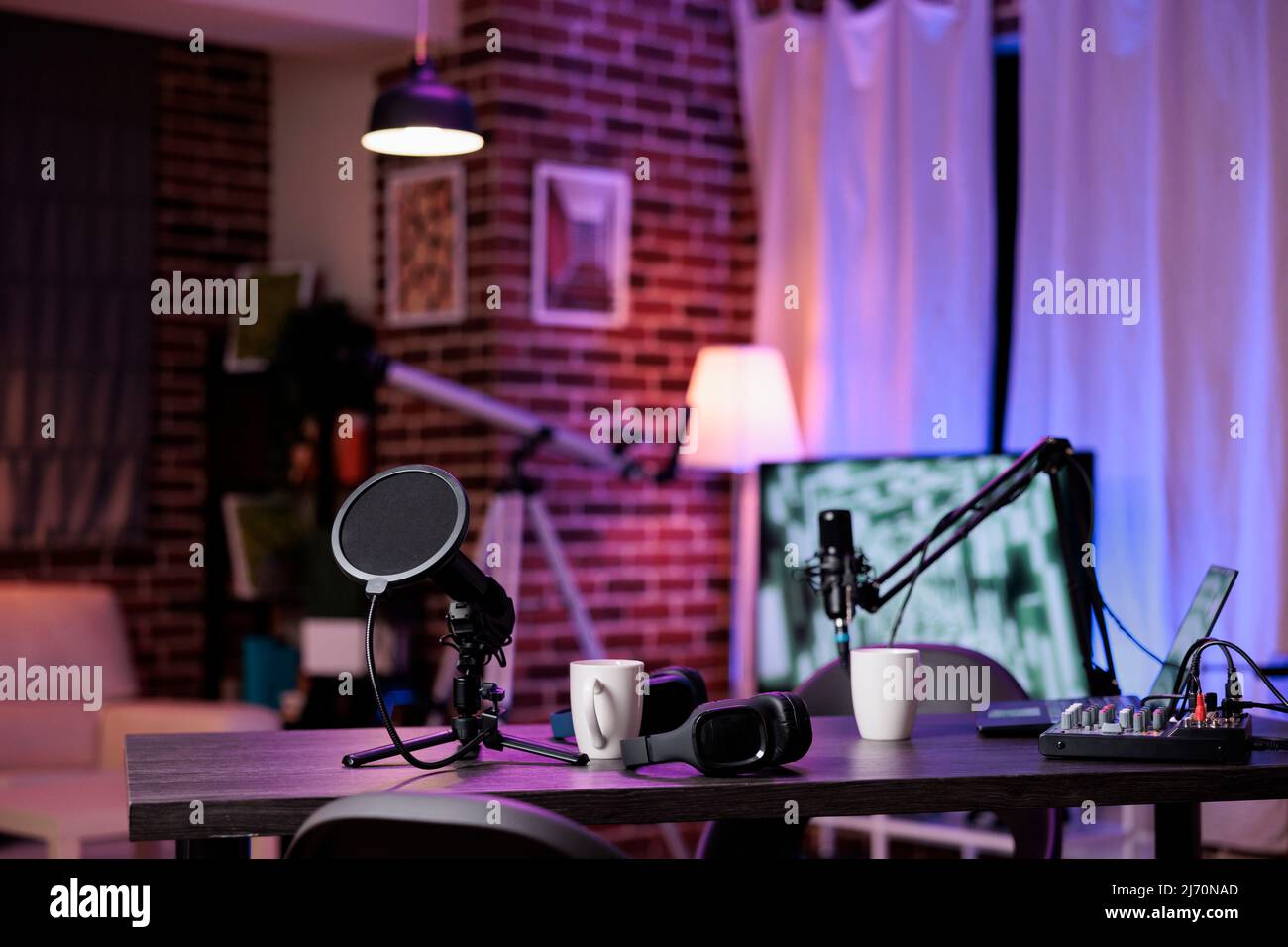 Nobody at empty desk with streaming equipment to broadcast live ...