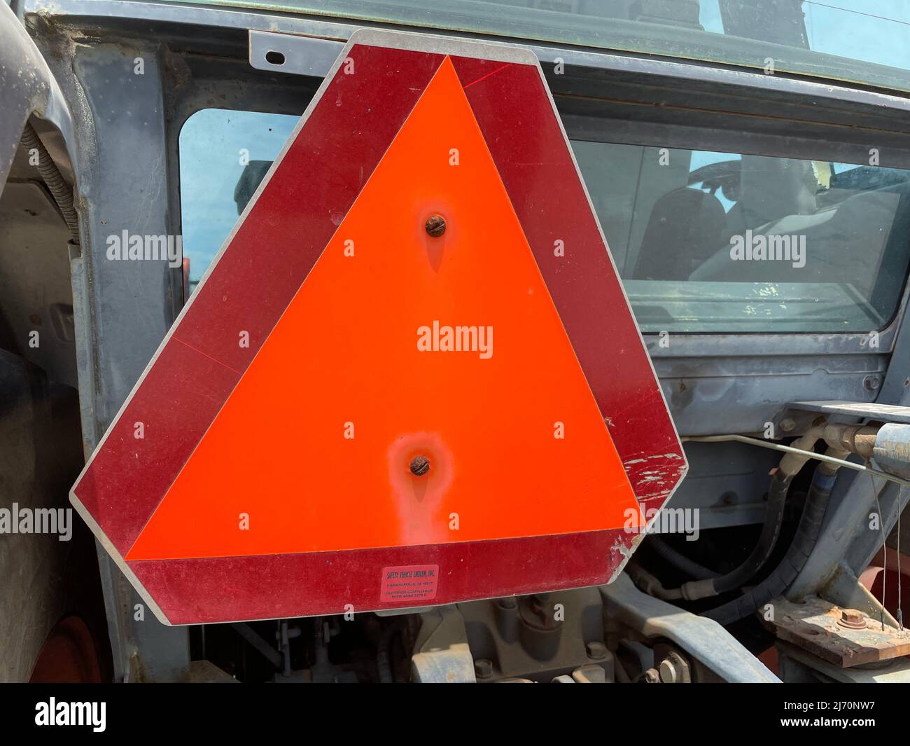 Augusta, Ga USA - 04 13 22: Kubota red tractor orange warning triangle ...