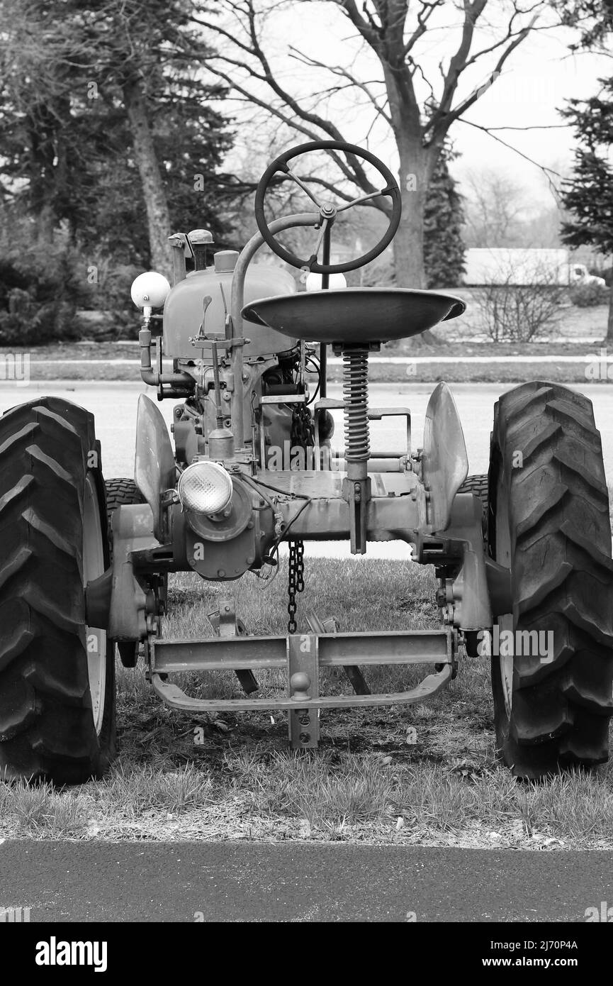 Traditional vintage tractor mechanical engine and frame in black and ...