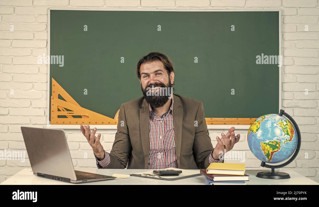 nice smile. informal education. male student sit in classroom while ...