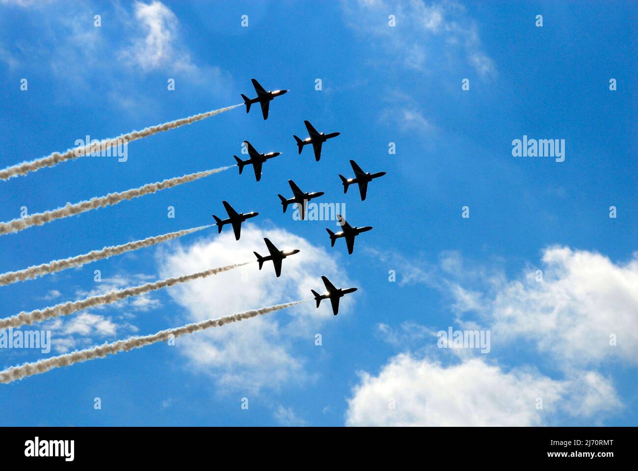 Red Arrows display team trailing white smoke in Diamond Nine formation ...