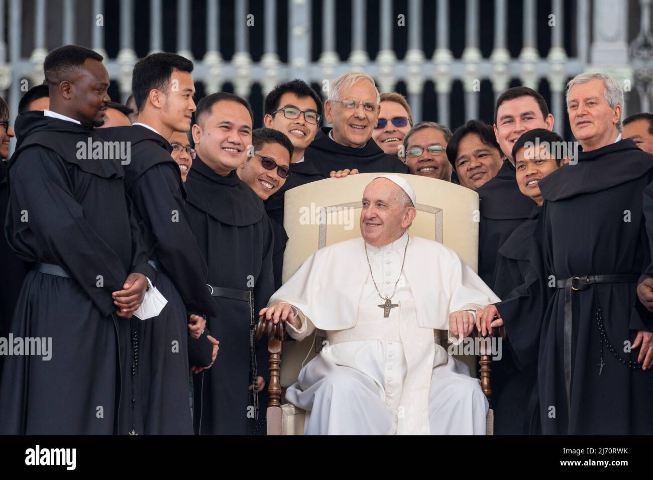 Pope Francis is surrounded by monks during his traditional Wednesday ...