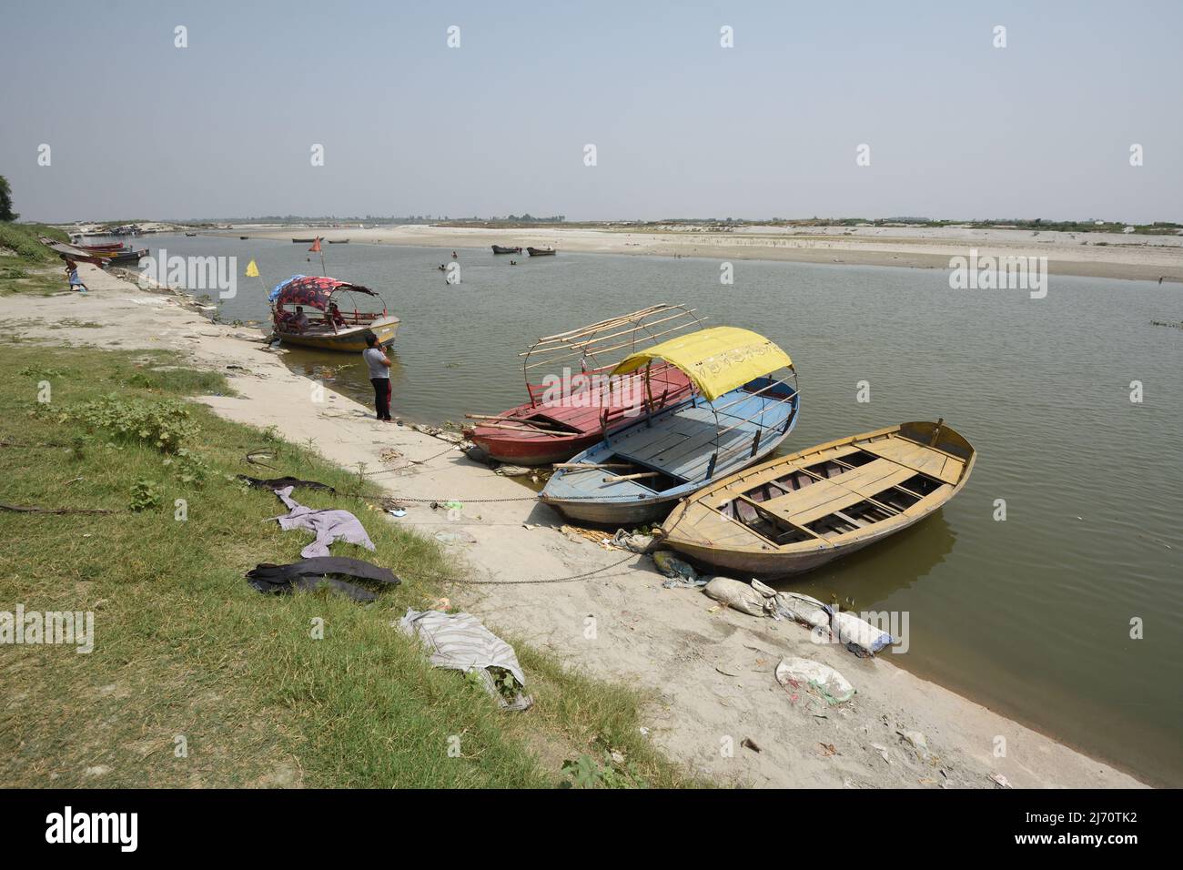 The Ganges with floating boats near Guptar Ghat or Narayan Ghat. Civil ...