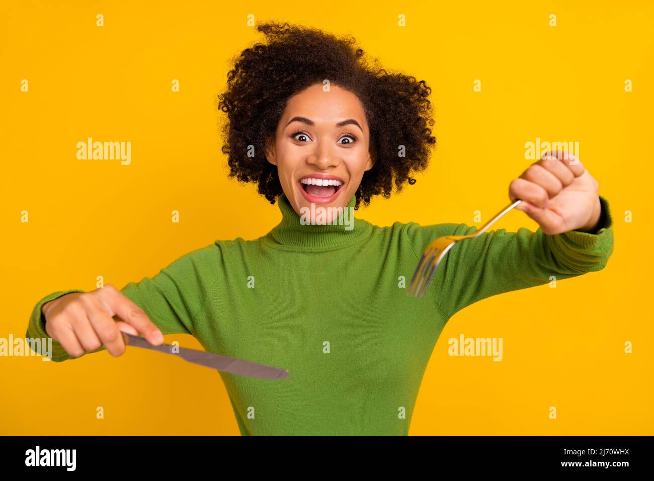 Portrait of attractive cheery funny girl holding fork eating invisible ...