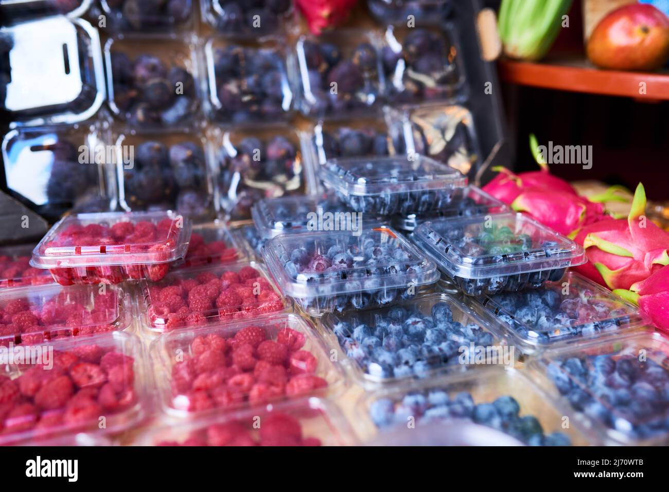 Berries on display at a market stall - raspberry, blueberry Stock Photo ...