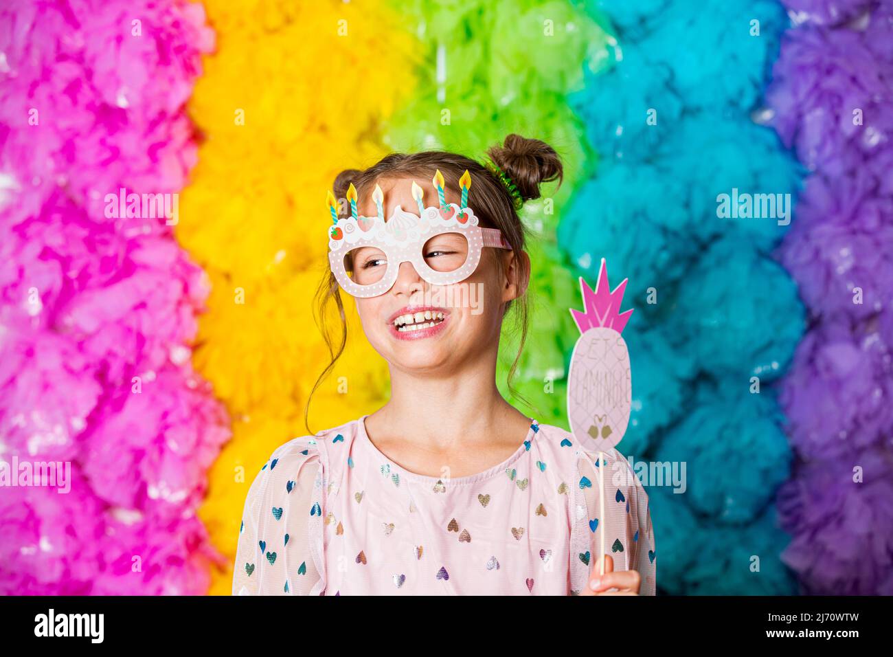 Cute girl celebrating birthday, wearing party paper glasses, laughing ...