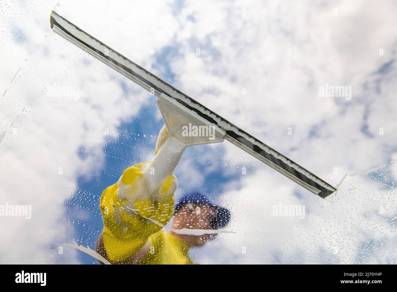 Cleaning window pane with detergent Stock Photo - Alamy