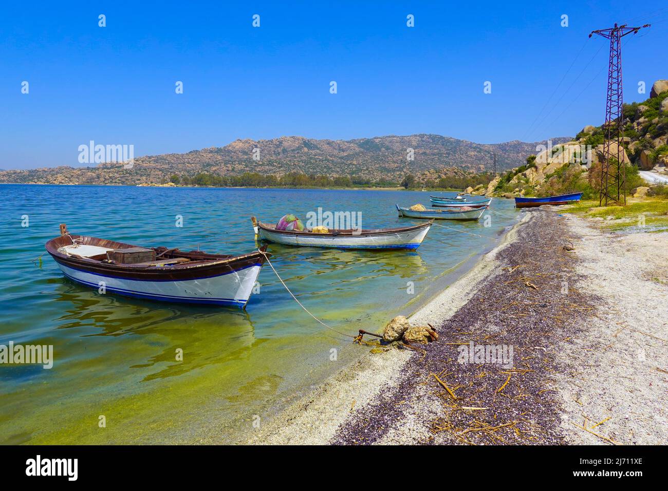 Small boat, rowing boat at Bafa Golu, Lake Golu, and the ancient city ...