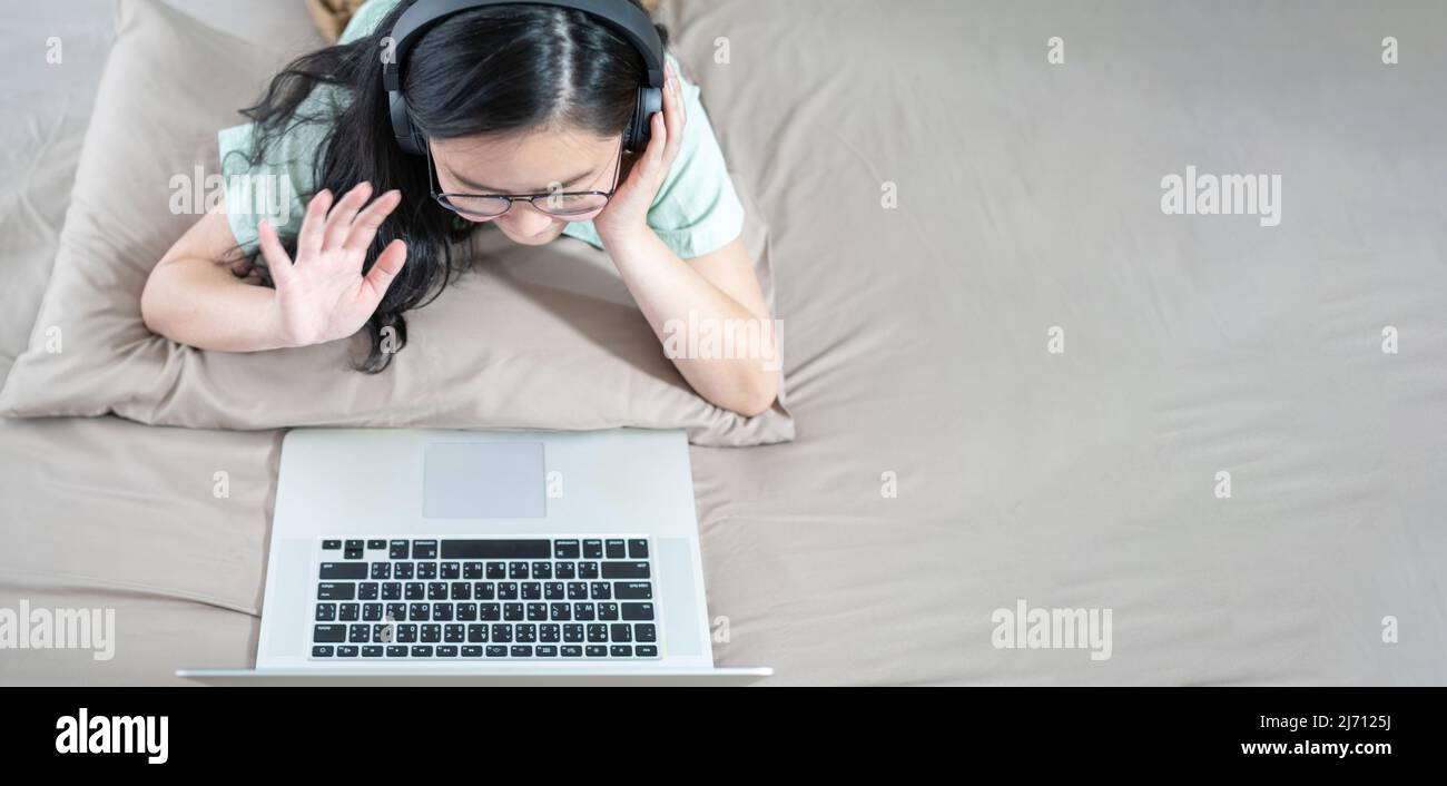 Beautiful Asian woman using zoom meeting and making facetime video ...