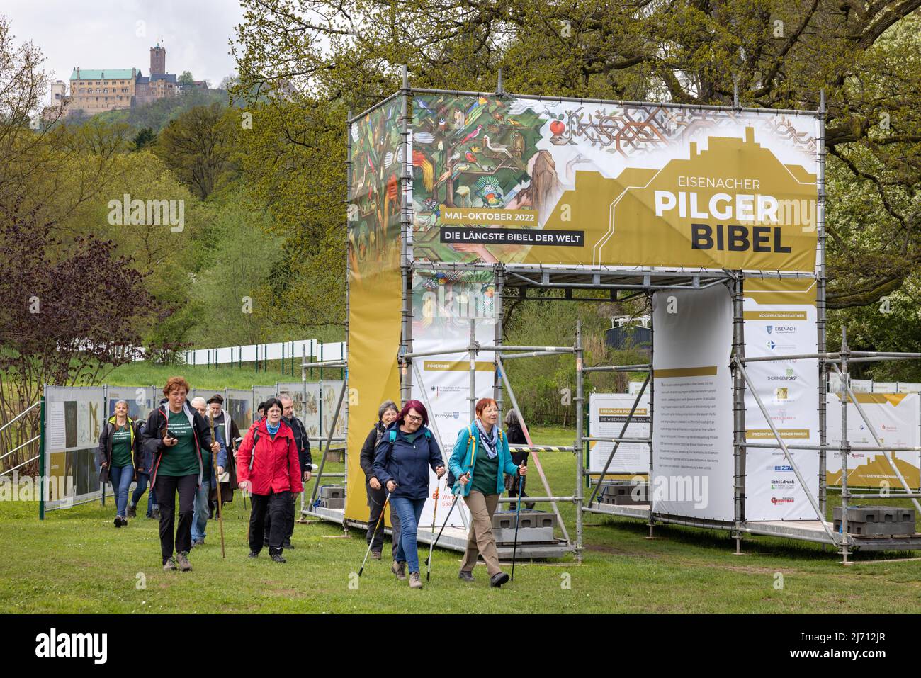 05 May 2022, Thuringia, Eisenach: Pilgrims walk along the "Pilgrim's ...
