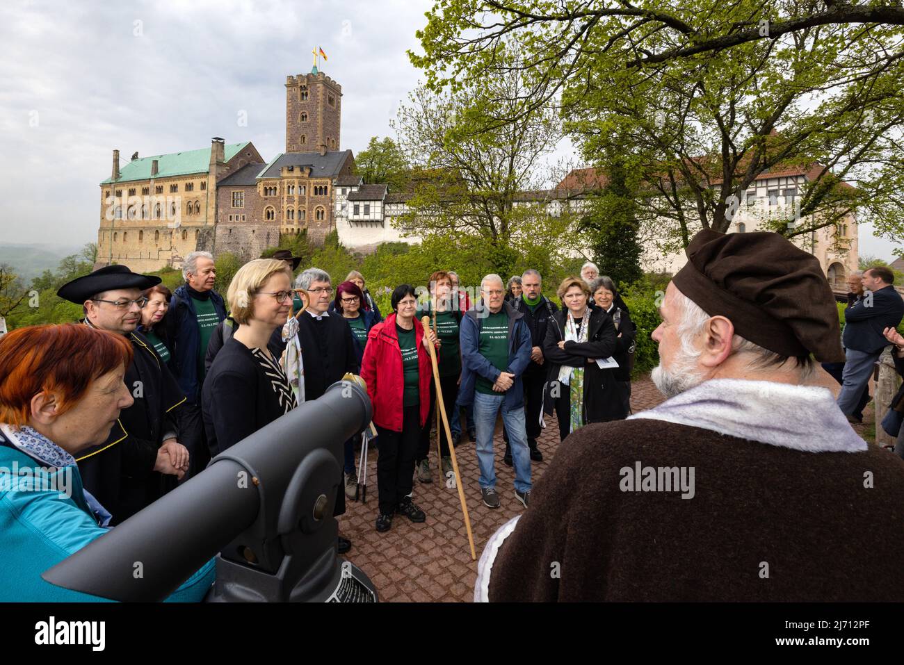 05 May 2022, Thuringia, Eisenach: Pilgrims start from Wartburg Castle ...