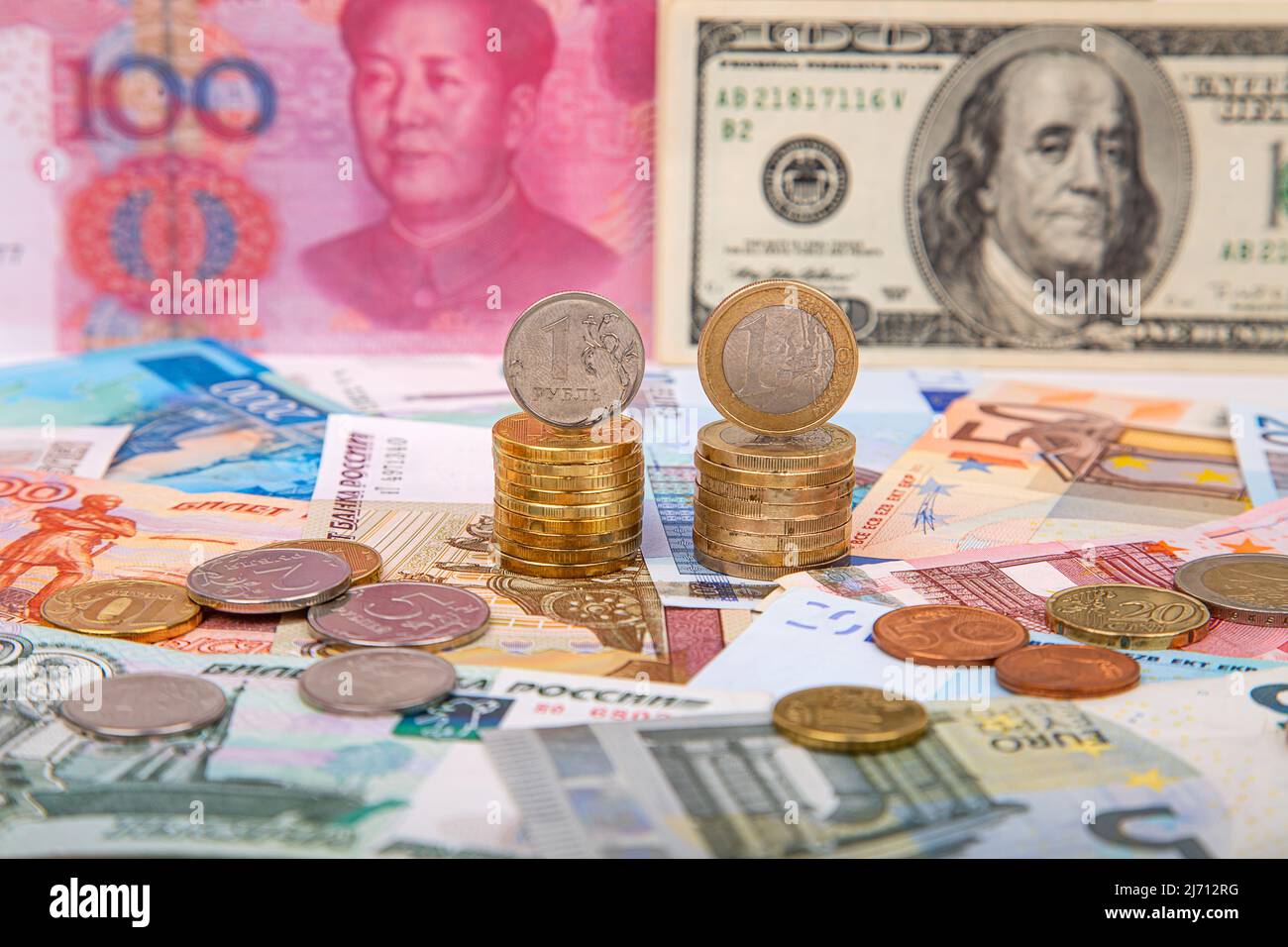 Rubles and euros against the background of yuan and dollars, close-up ...