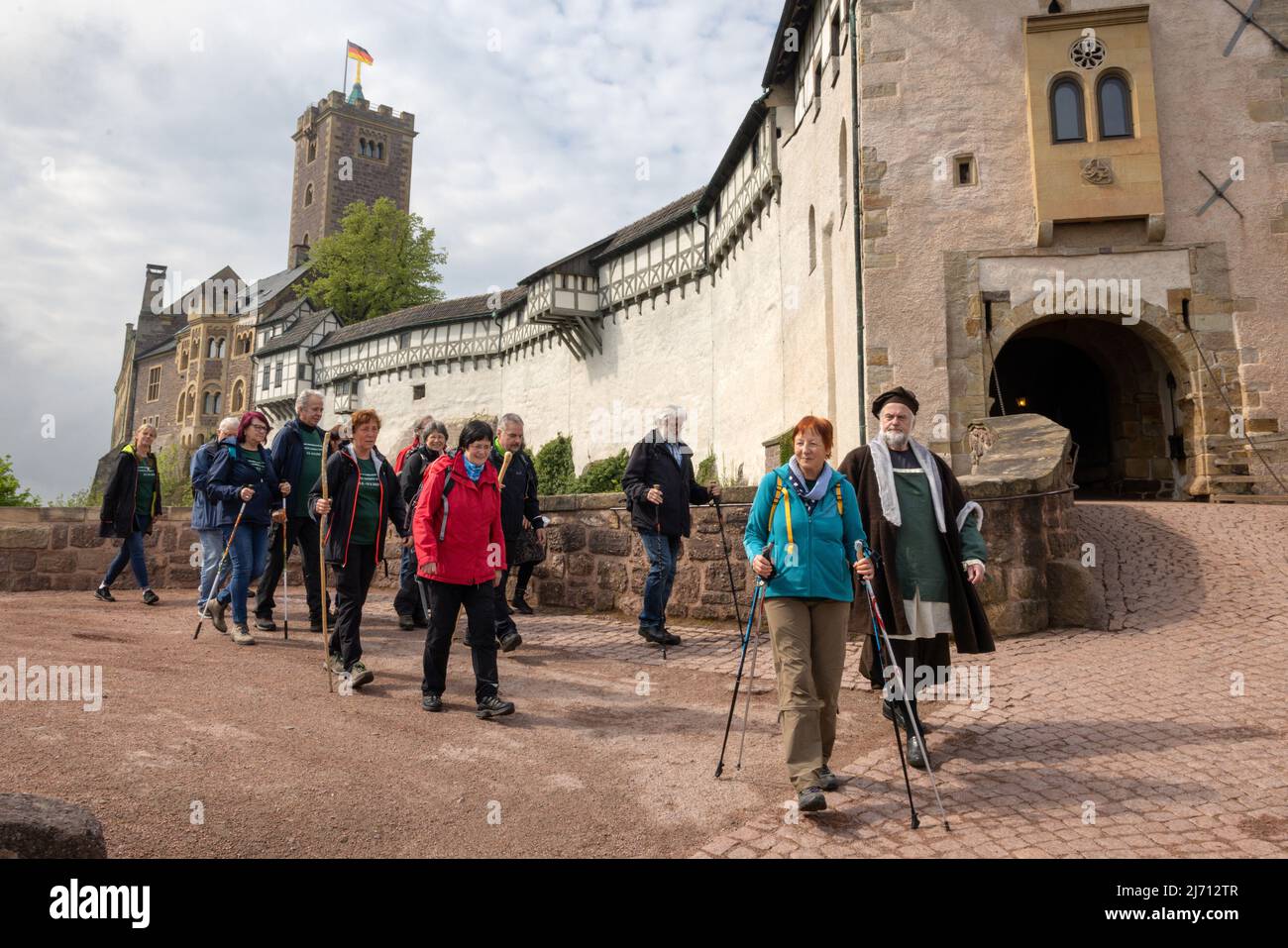 05 May 2022, Thuringia, Eisenach: Pilgrims start from Wartburg Castle ...