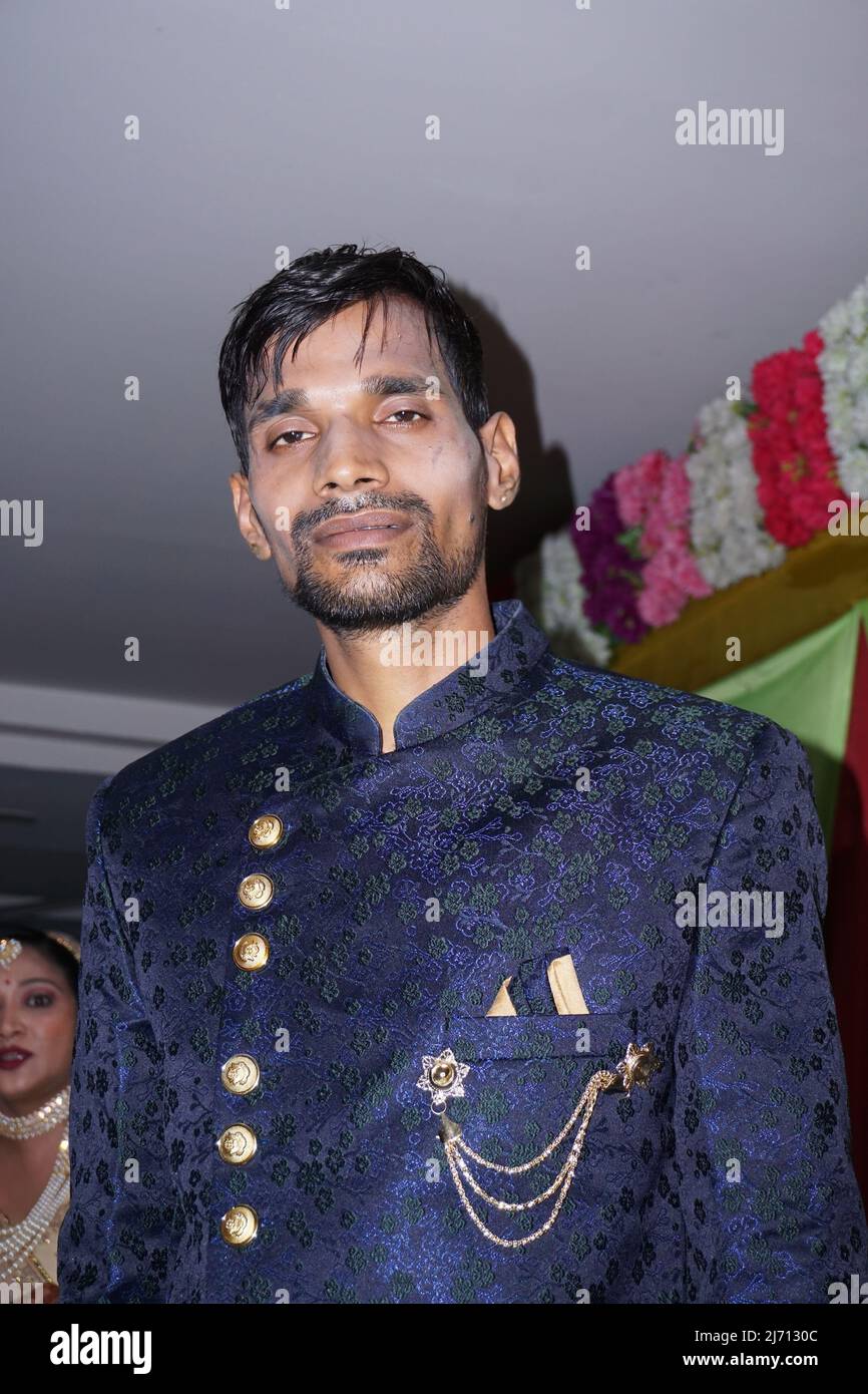 Indian groom wearing the traditional sherwani attire Stock Photo - Alamy