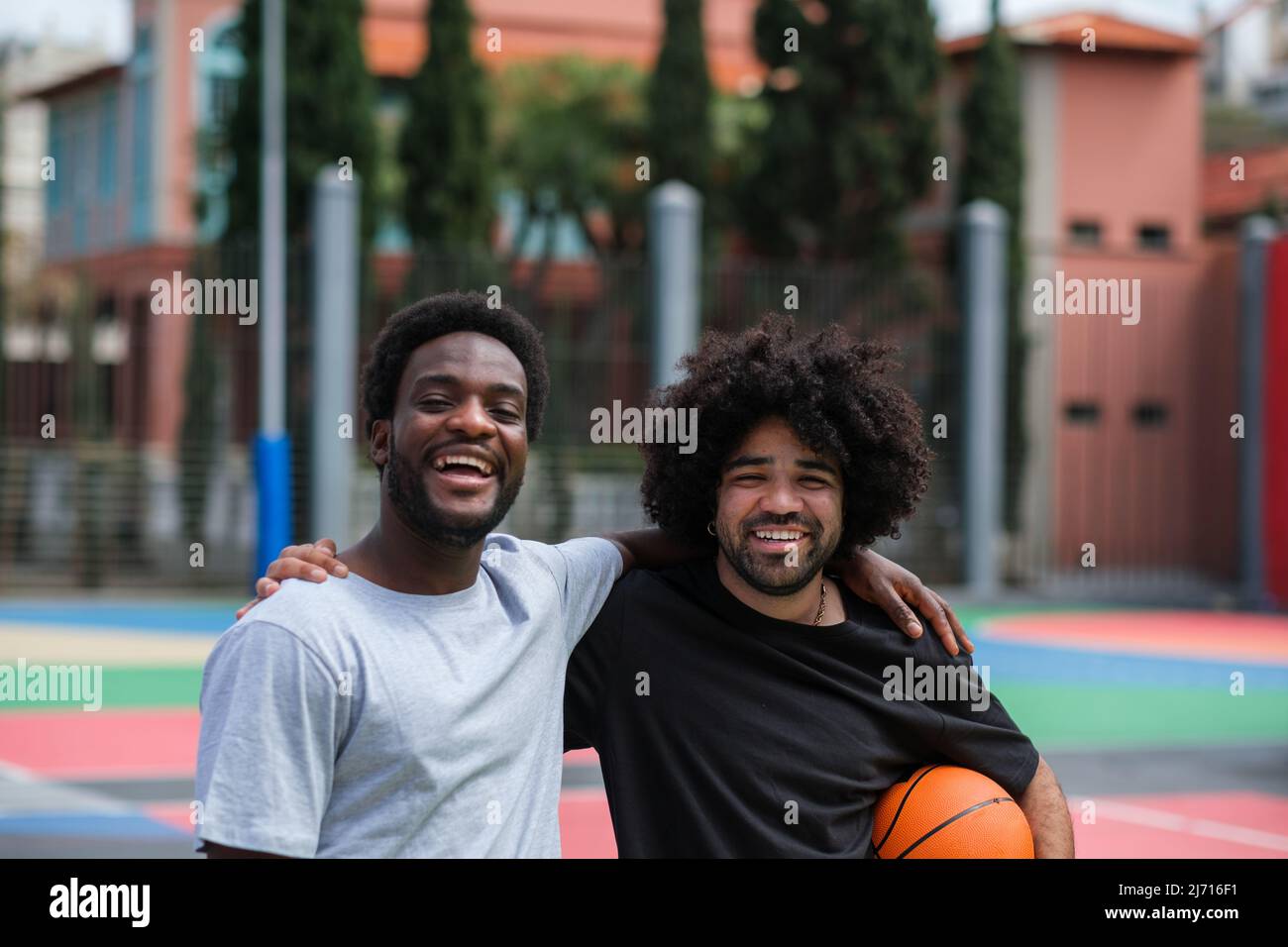 Two friends enjoying an afternoon of basketball Stock Photo - Alamy