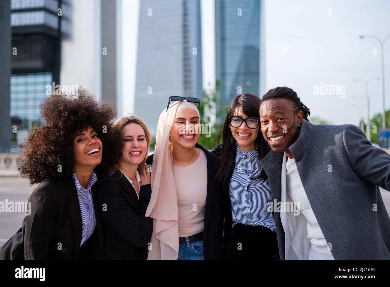 Diverse group of people taking photos in financial district Stock Photo ...