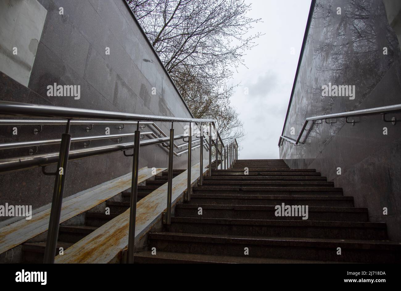 Stairs with metal railings from the underpass. Bottom view Stock Photo ...